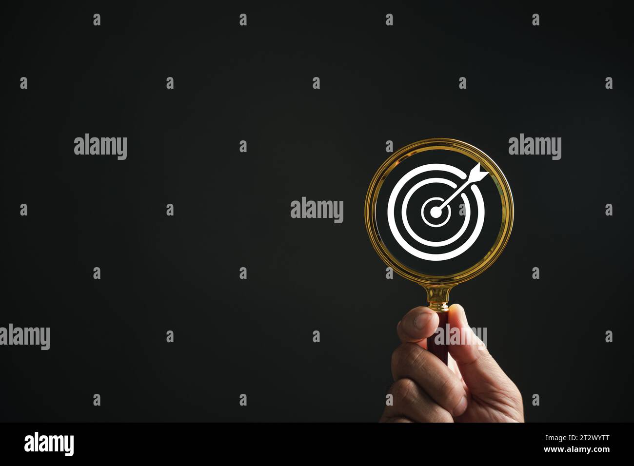 Target board inside magnifier glass for focus business objective Stock ...