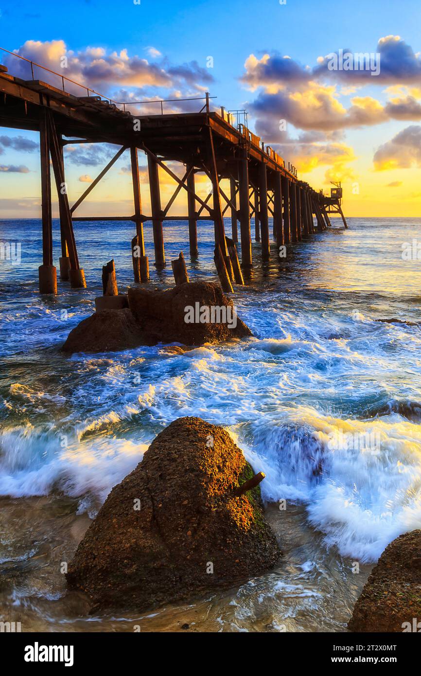 Old forgotten timber jetty at MIddle Camp beach in Australia Pacific ...