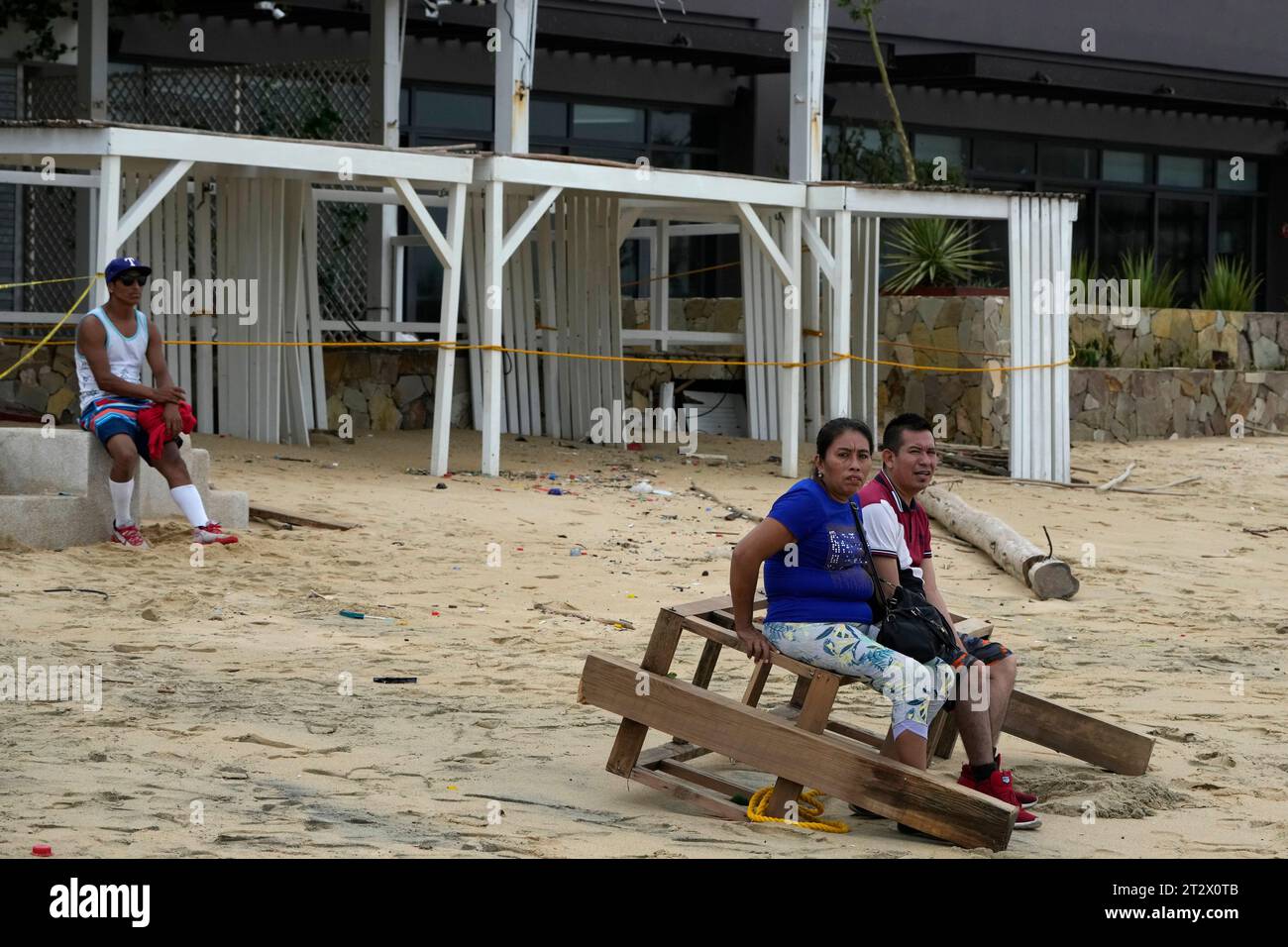 People sit outside their homes after Hurricane Norma's passage in Cabo ...