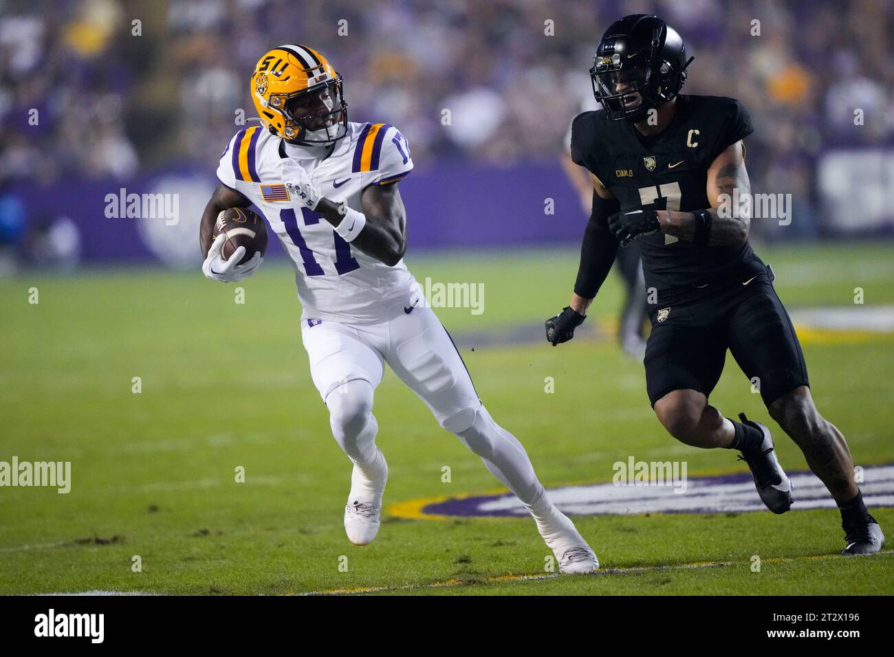 LSU wide receiver Chris Hilton Jr. (17) carries past Army linebacker ...