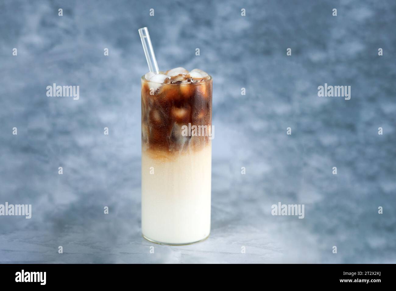 Ice Coffee in Tall Glass with Glass Straw. Ice Cubes and Beans on a ...
