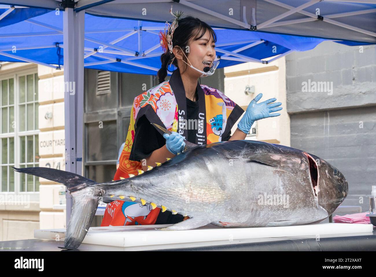 Members of Sabaki Girl Project perform bluefin tuna cutting during ...