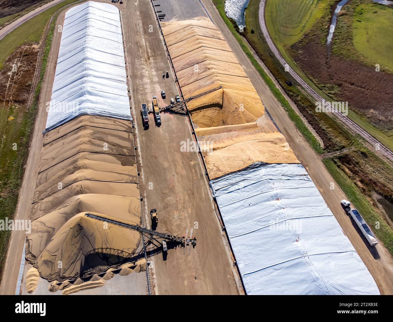 Drone view over grain storage piles being filled and covered Stock ...