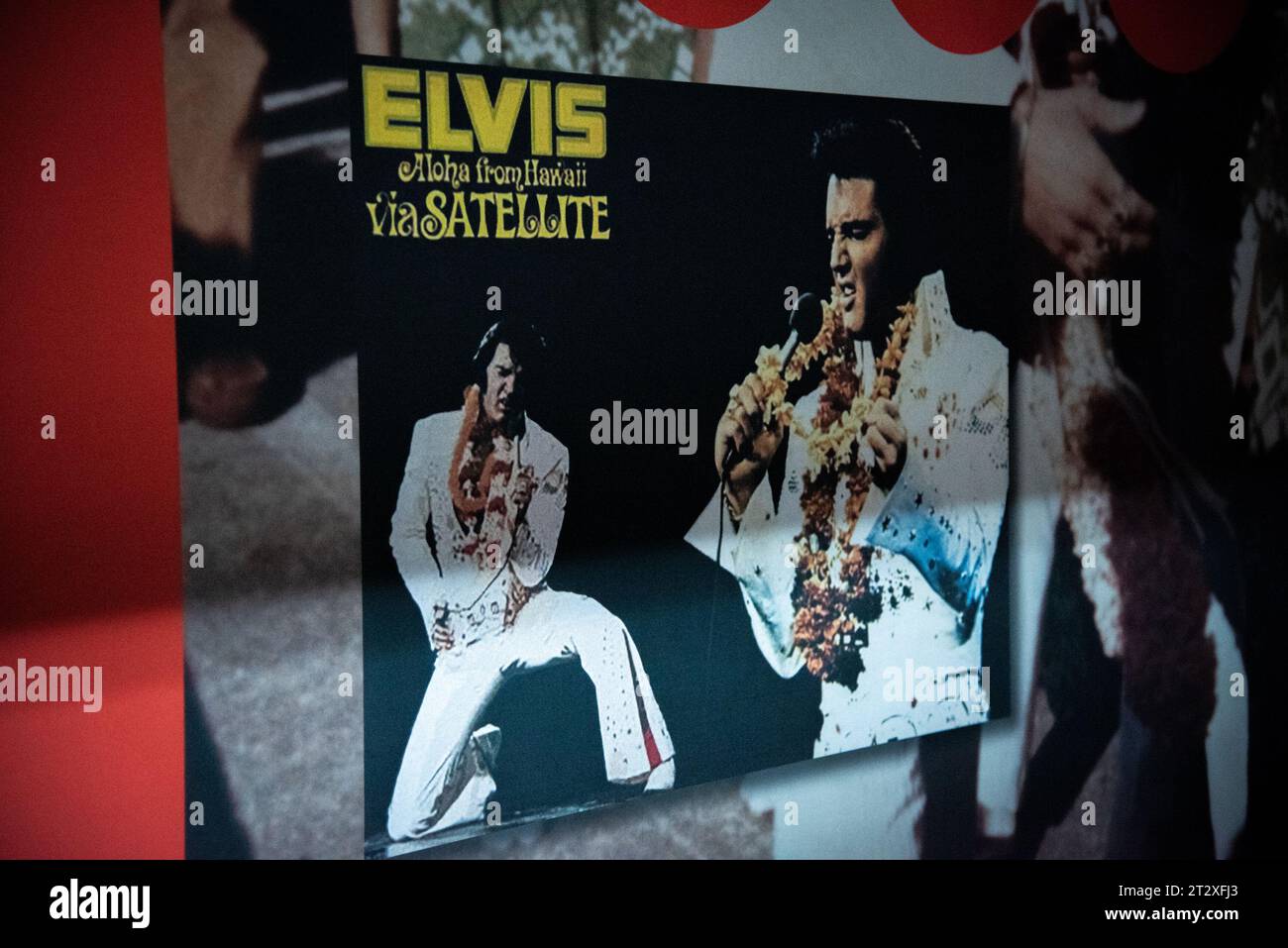 Black and white photographs of Elvis Presley performing, displayed at the Direct from Graceland ...