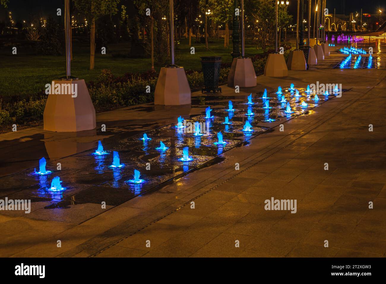 Water splash at the location in the park with a mini fountain located ...