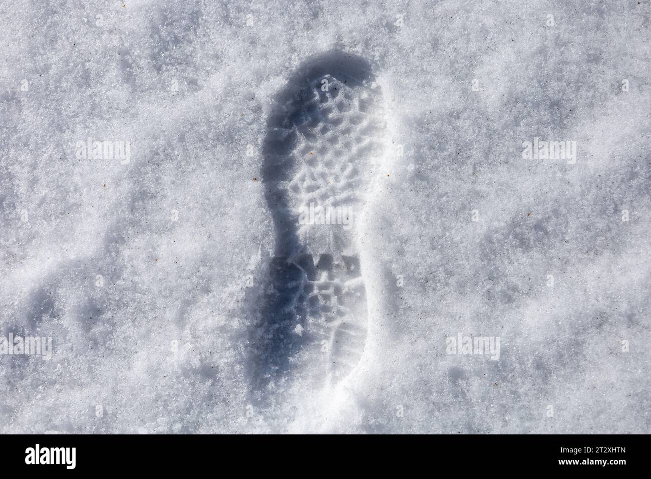 Footprint in the snow Stock Photo - Alamy
