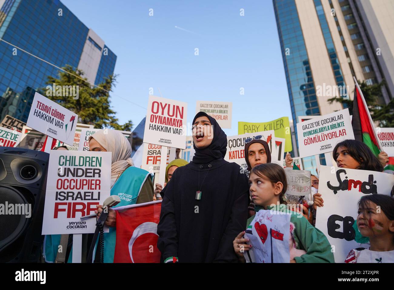 Demonstrators seen holding placards and shouting slogans against Israel ...