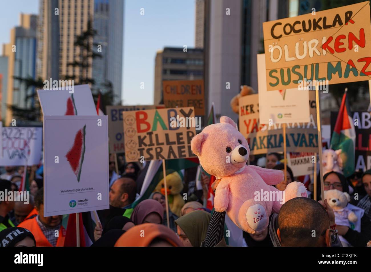 Demonstrators seen holding placards and shouting slogans against Israel ...
