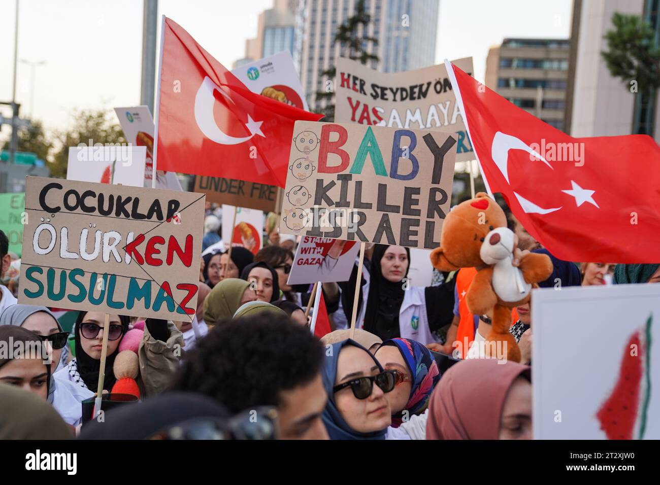 Demonstrators seen holding placards and shouting slogans against Israel ...