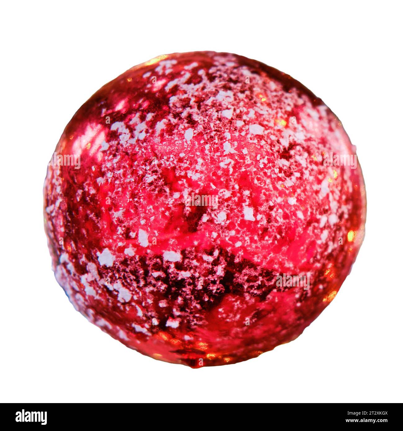 A large red ball covered with snow as a decoration for the New Years ...