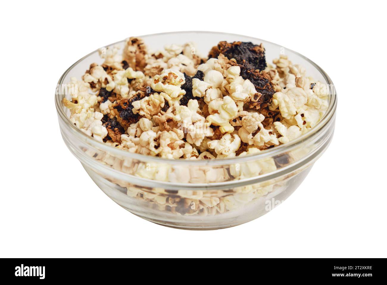 Burnt popcorn from a home microwave. Burn corn kernels on the kitchen ...