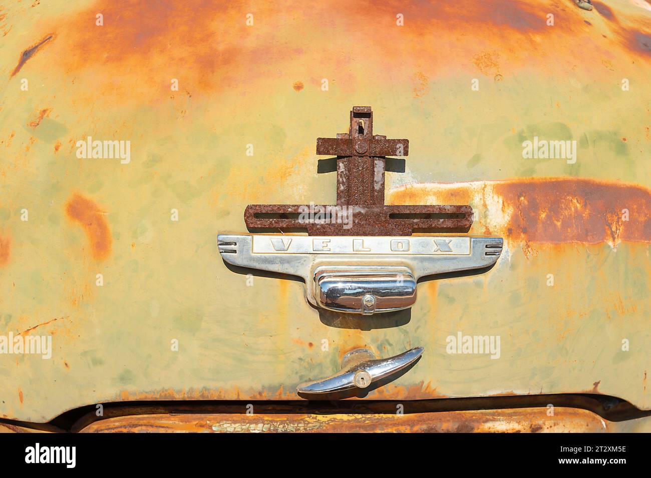 Old rusty Vauxhall Velox car badge Stock Photo - Alamy