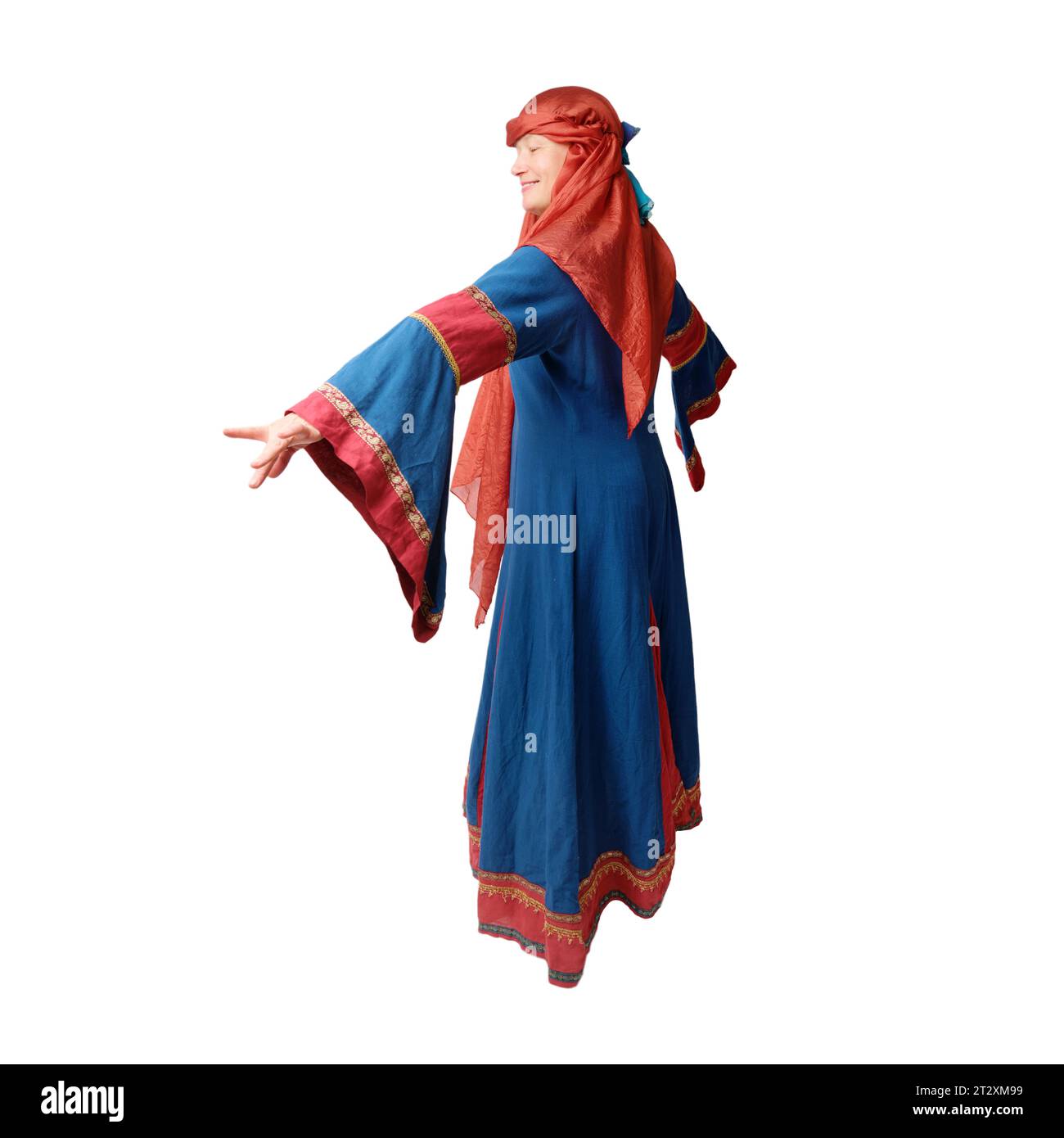 Woman in medieval European dress dancing on studio background, isolated ...