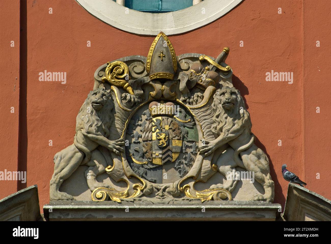 Coat of arms over entrance at Saint Nicholas Church in Otmuchów ...