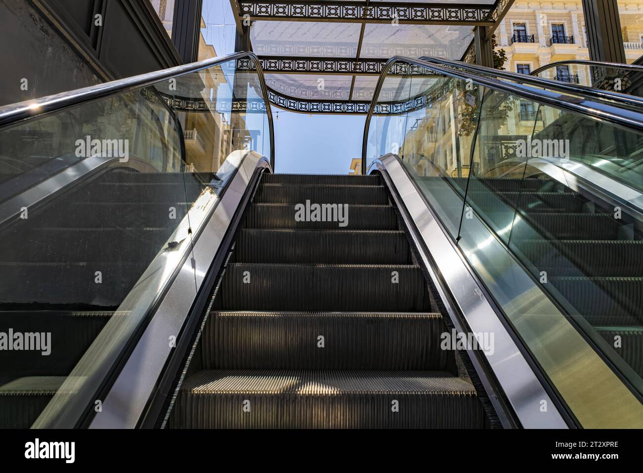 Modern urban indoor staircase escalator for climbing up to a business ...