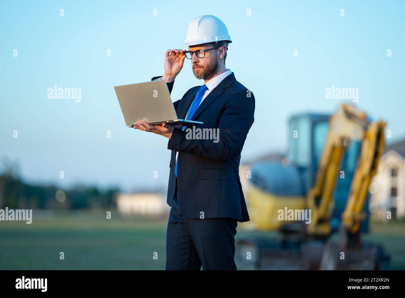 Successful construction business owner. Construction worker in suit and ...