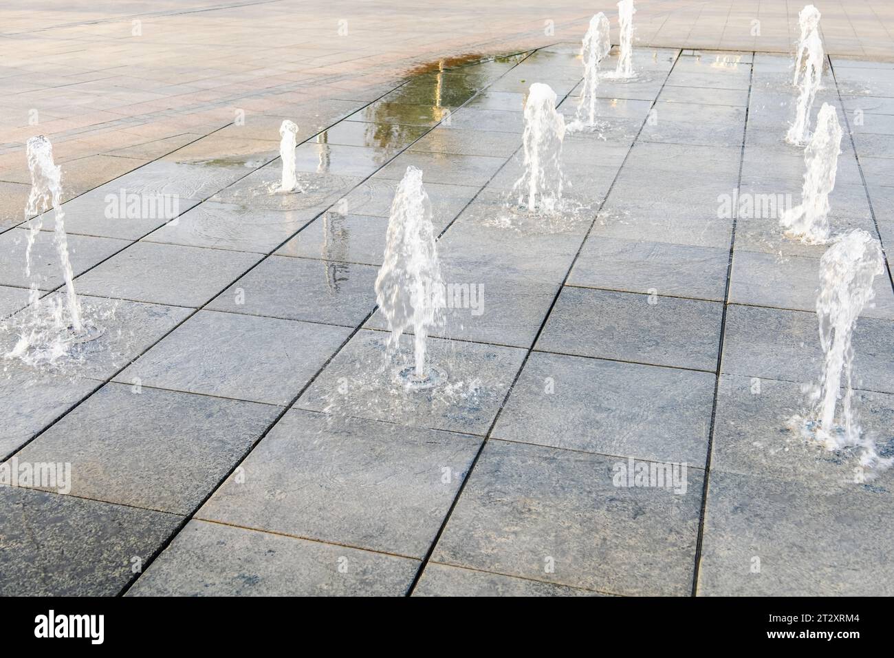 Water splash at the location in the park with a mini fountain located ...