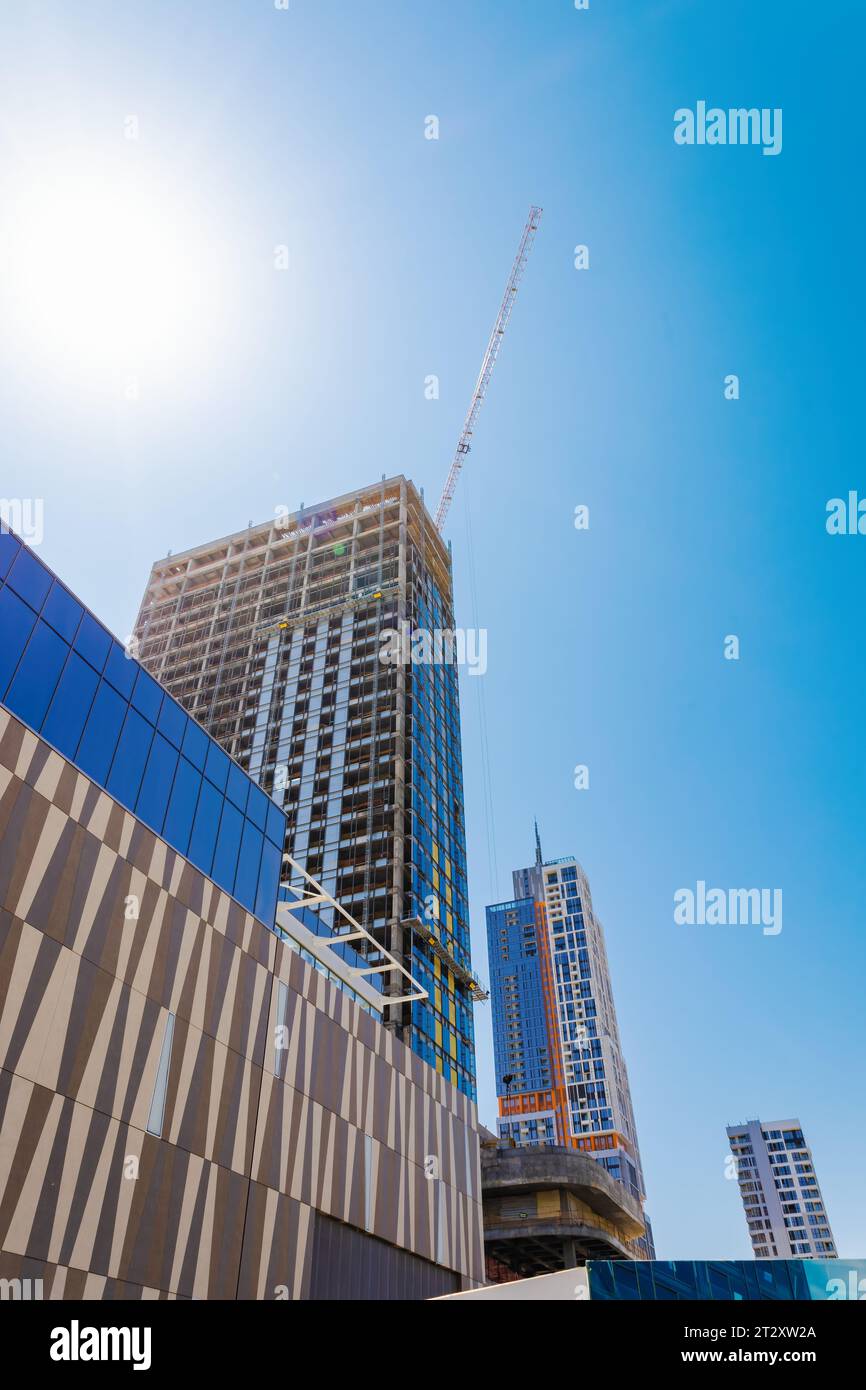 The subject of the photo is the construction of a building of a ...