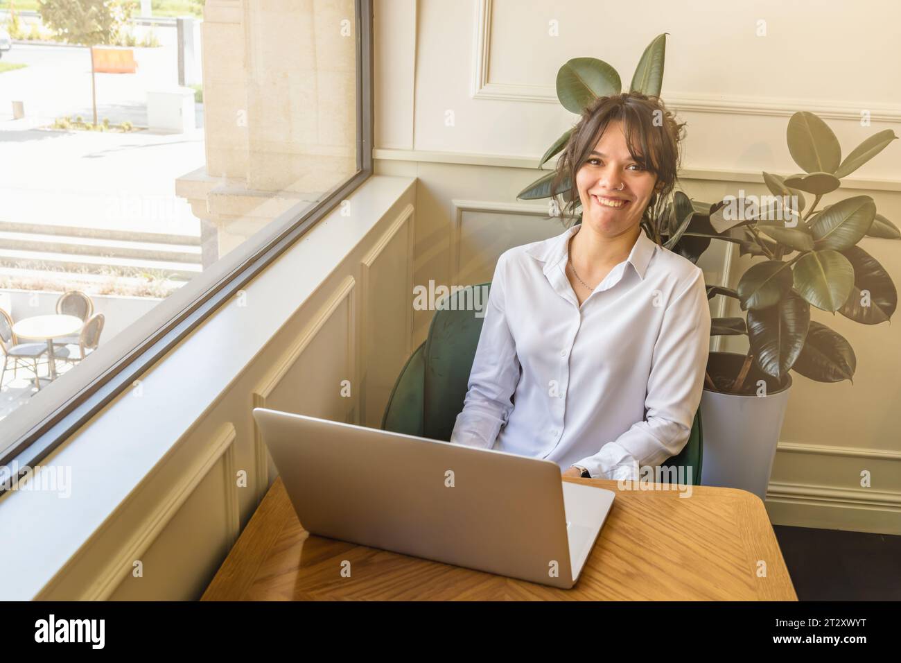 Girl behind a laptop with crazy abnormal emotions from long work Stock ...