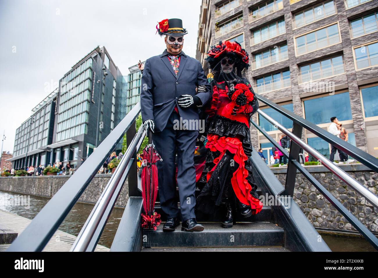 A couple dressed as Catrin and Catrina (female and male skeletons) is ...