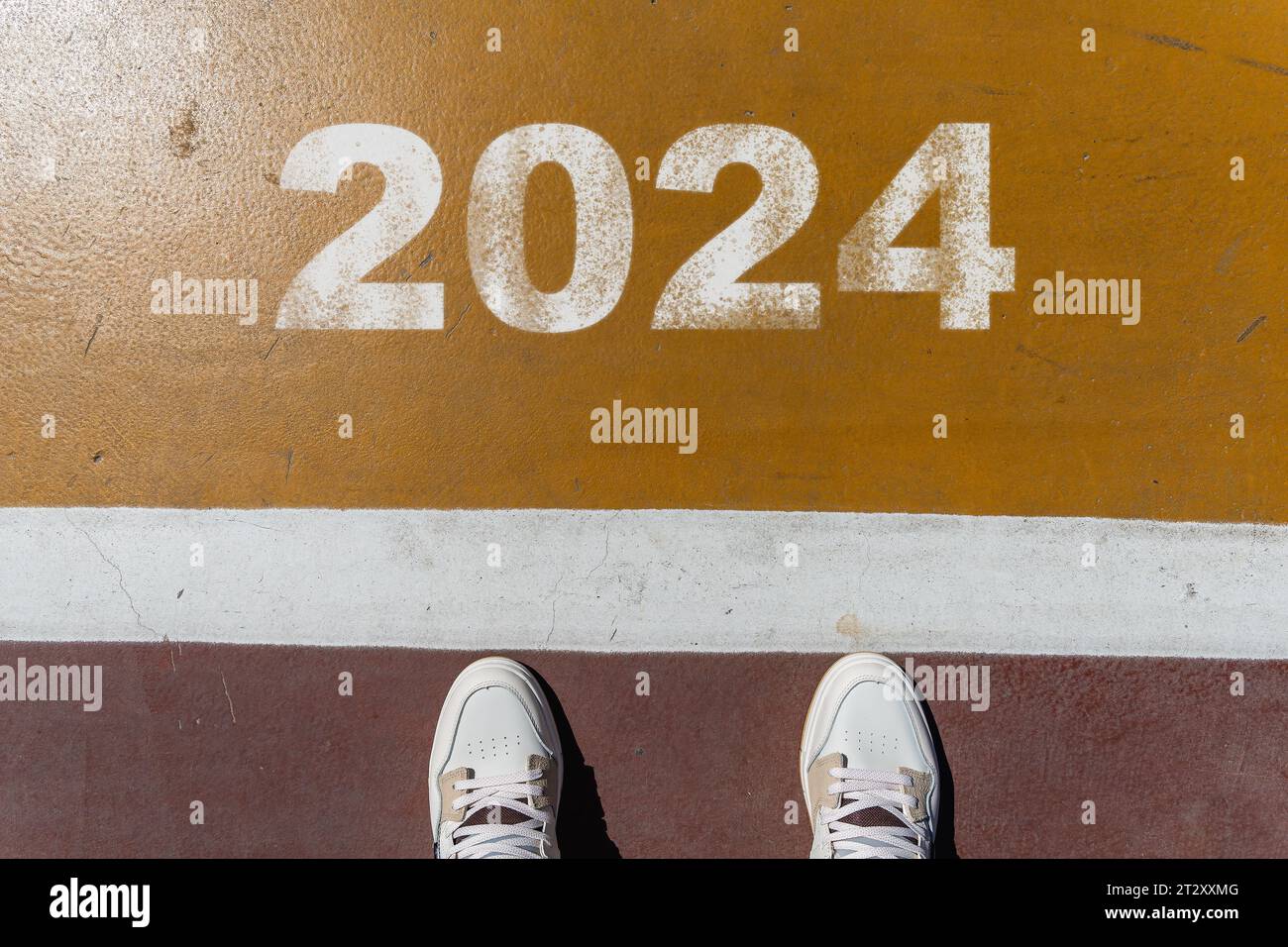 The beginning of 2024 is written on a colorful road. Conceptual photo ...