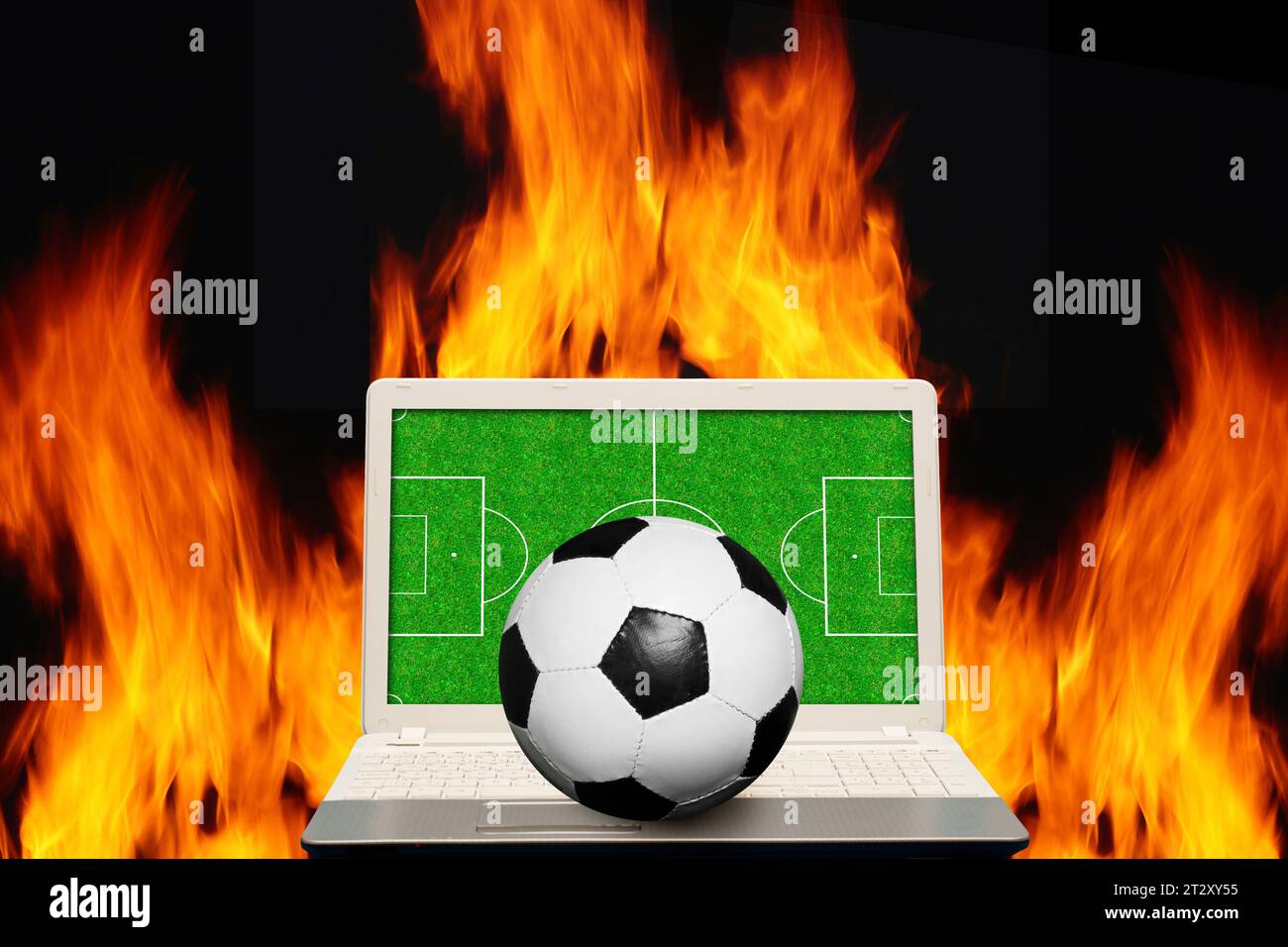 laptop with a soccer ball and pitch on screen Stock Photo - Alamy