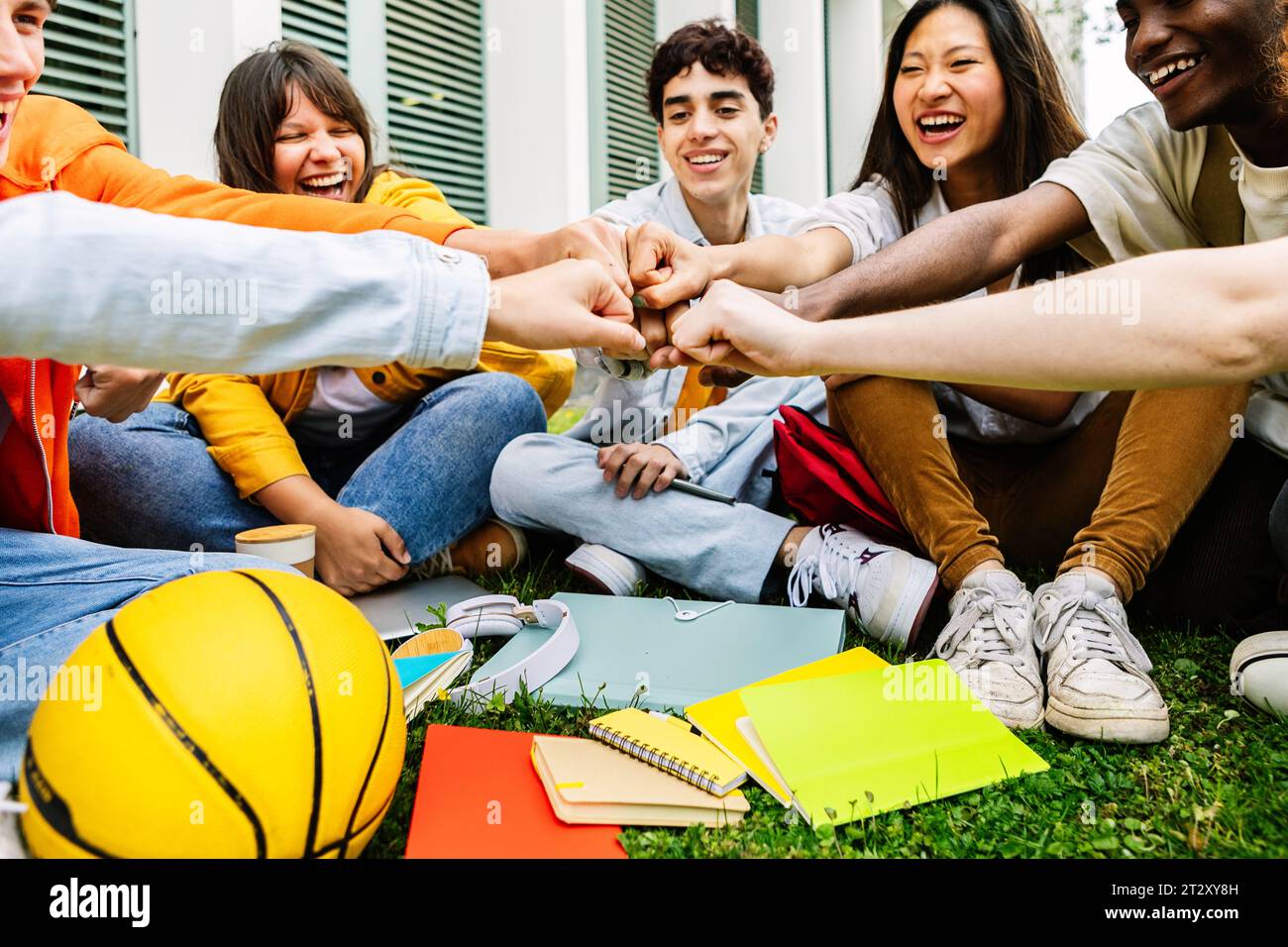 Group students joining hands hi-res stock photography and images - Alamy