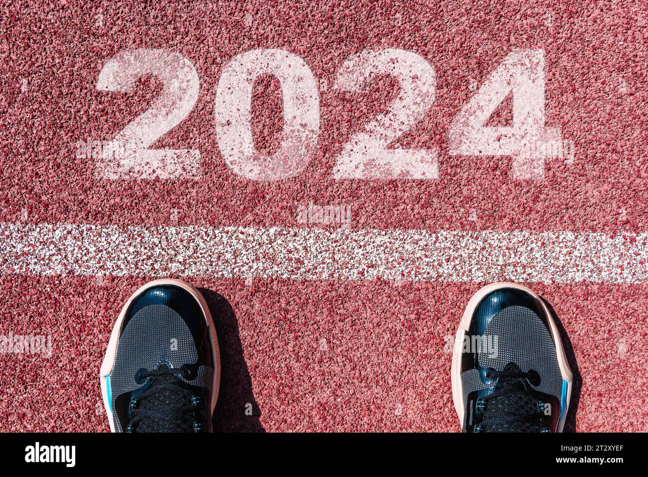The beginning of 2024 is written on a colorful road. Conceptual photo ...