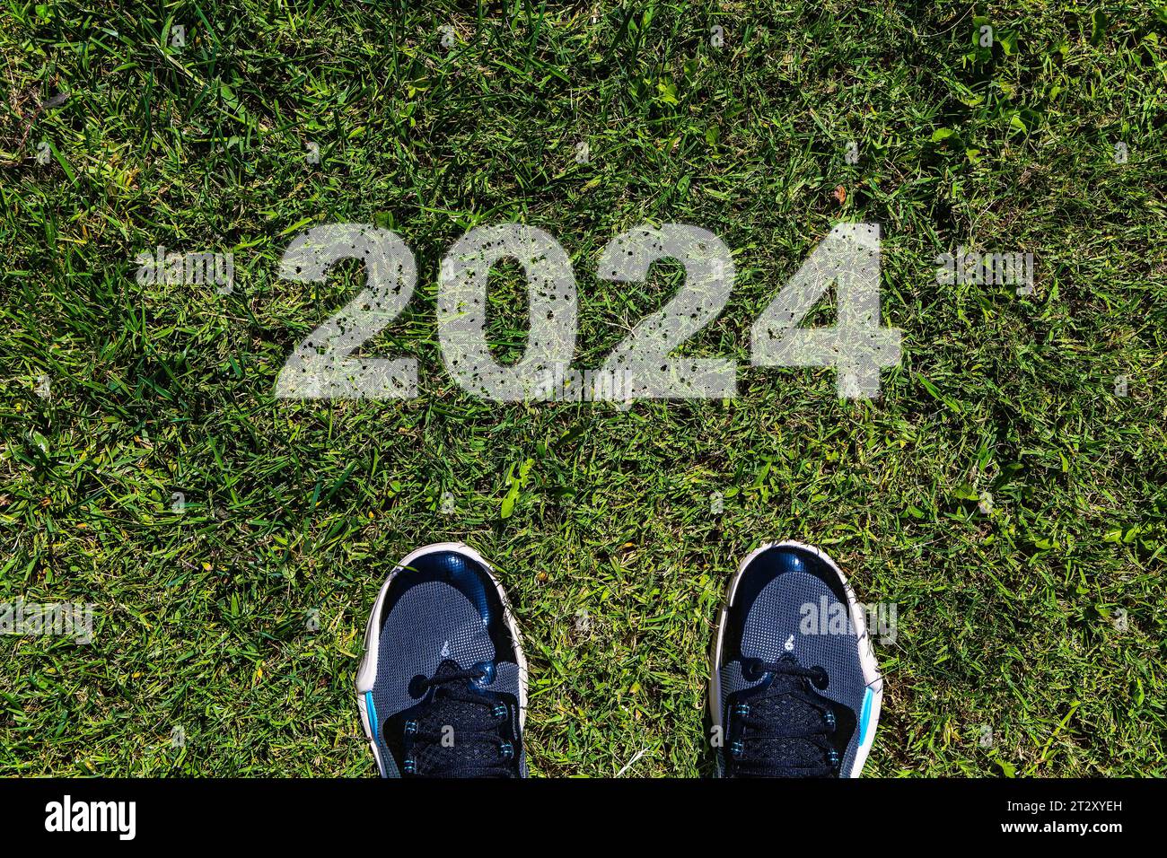 The beginning of 2024 is written on a colorful road. Conceptual photo ...