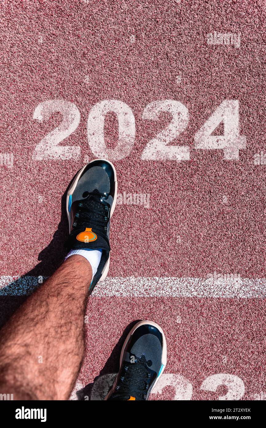 The beginning of 2024 is written on a colorful road. Conceptual photo ...