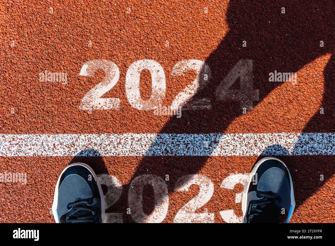 The beginning of 2024 is written on a colorful road. Conceptual photo ...