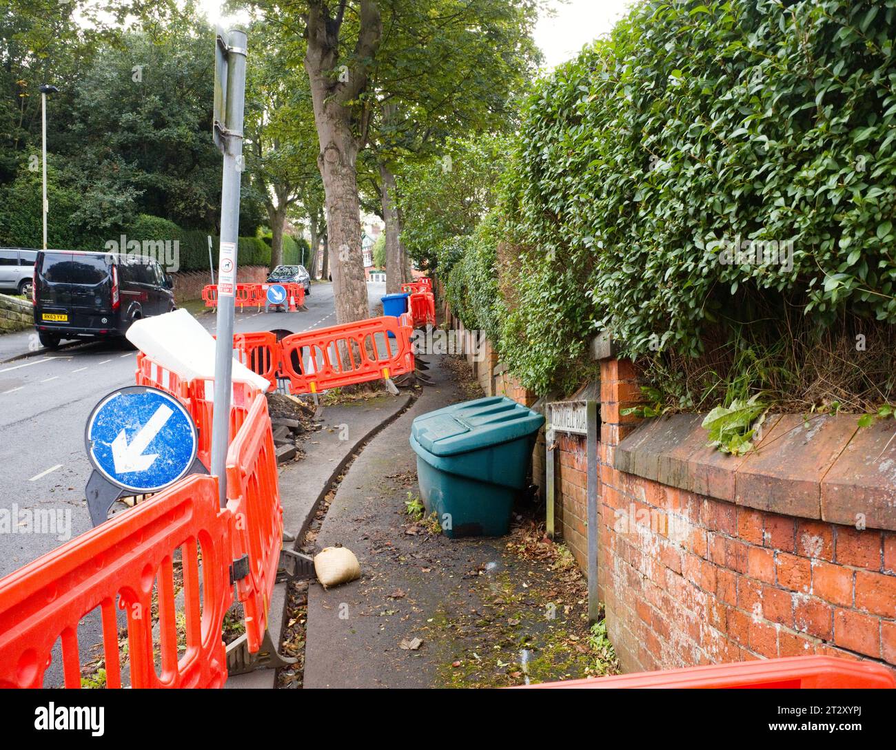 Chaotic scene of fibre optic cable being laid in pavements at ...