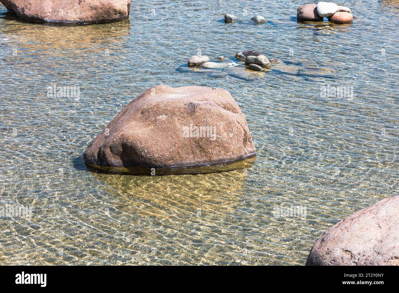 Background sea water near the shore with a stone shore Stock Photo - Alamy