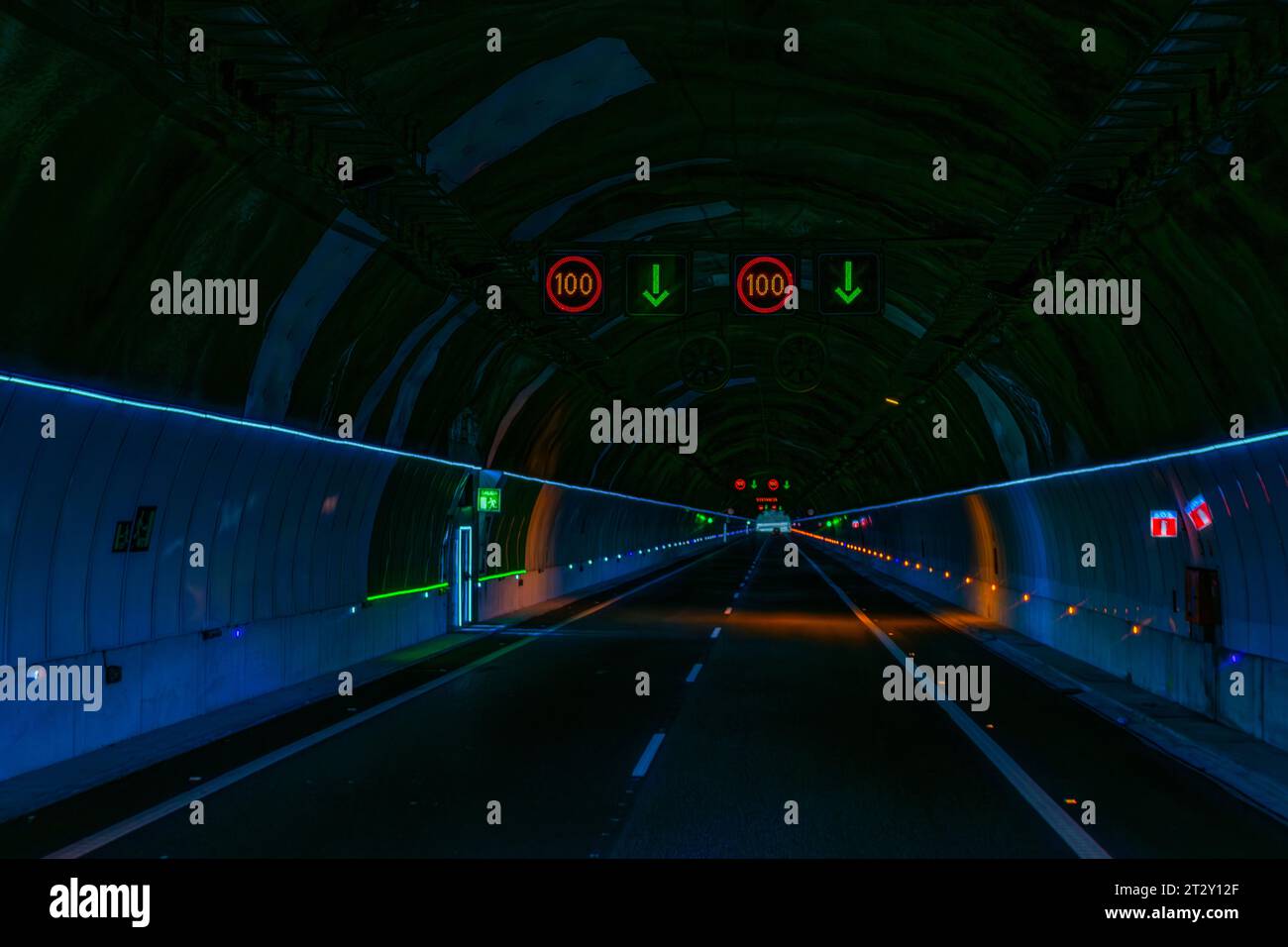 Illuminated signs of maximum speed allowed 100 km/h inside a highway ...