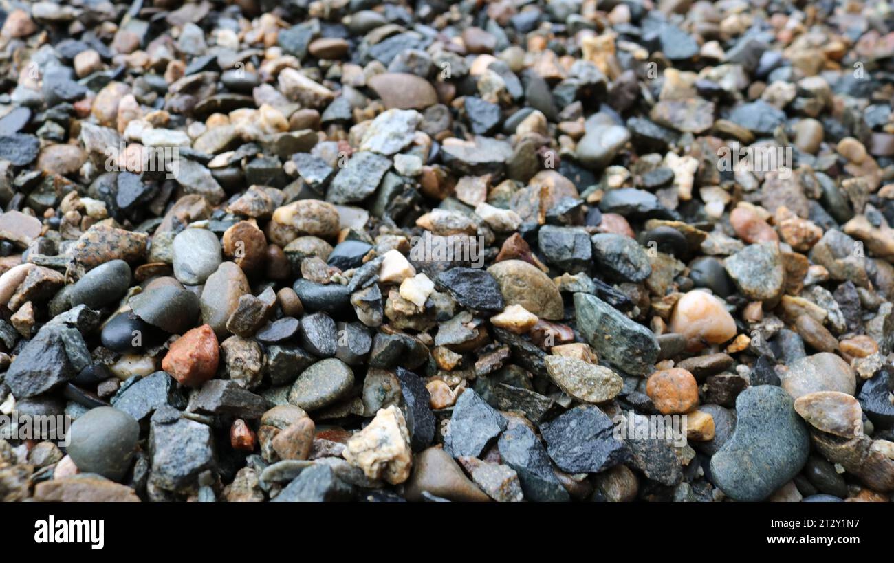 wet gravel close-up blurred along the edge of the picture, gray crushed ...