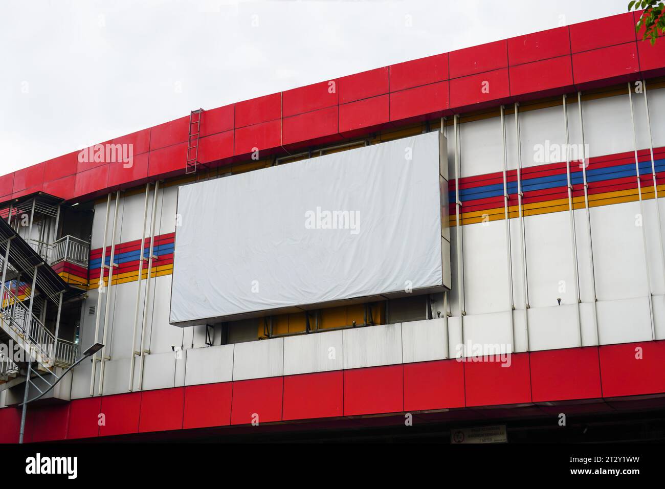 a large empty banner for an outdoor billboard, suspended on a building ...
