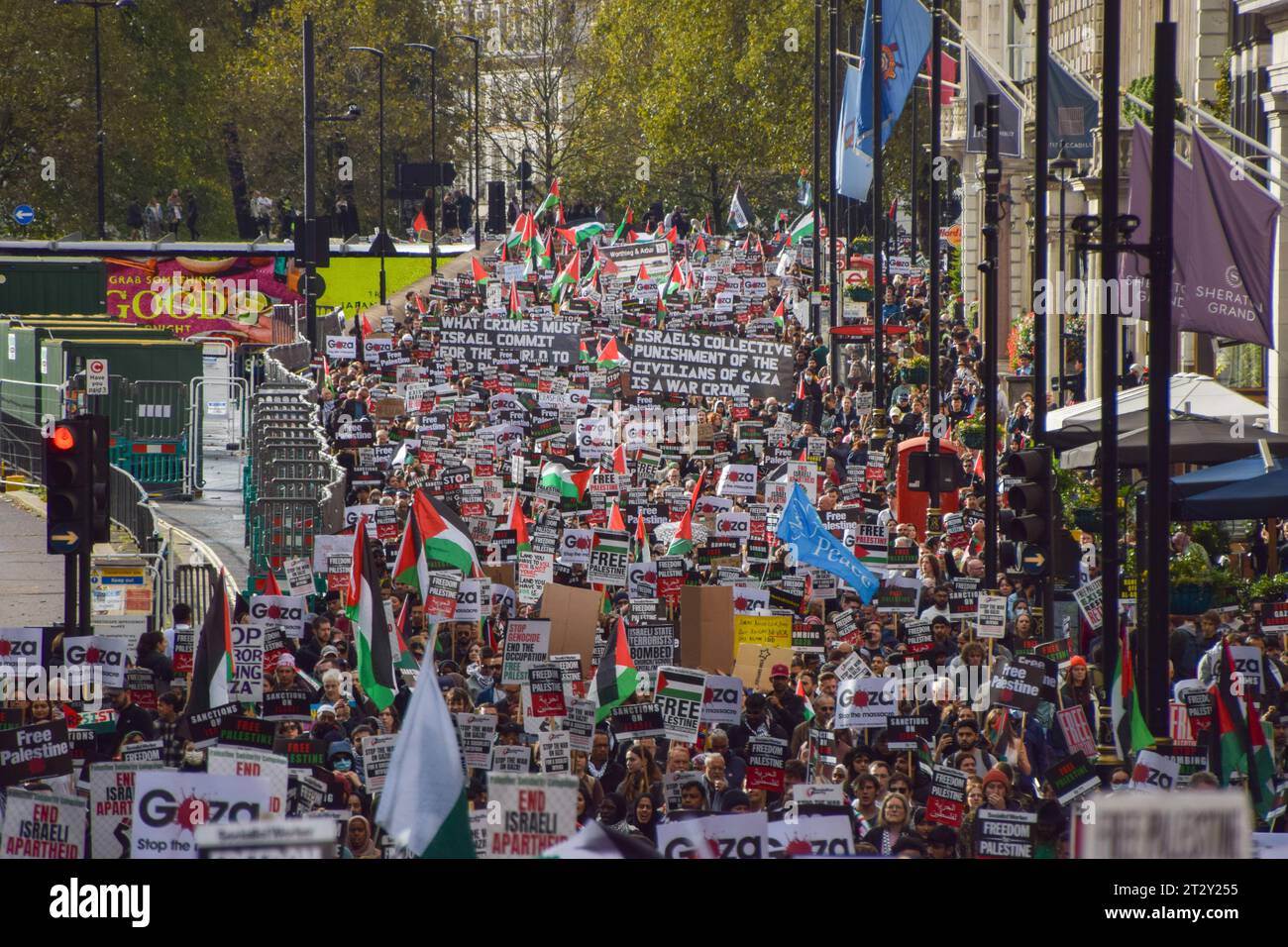 London, UK. 21st October 2023. Protesters pass by Green Park. Tens of ...
