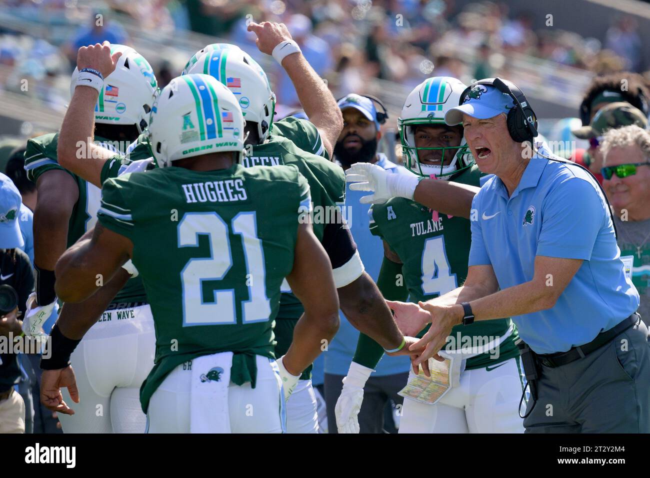Tulane head coach Willie Fritz congratulates his team after a score ...
