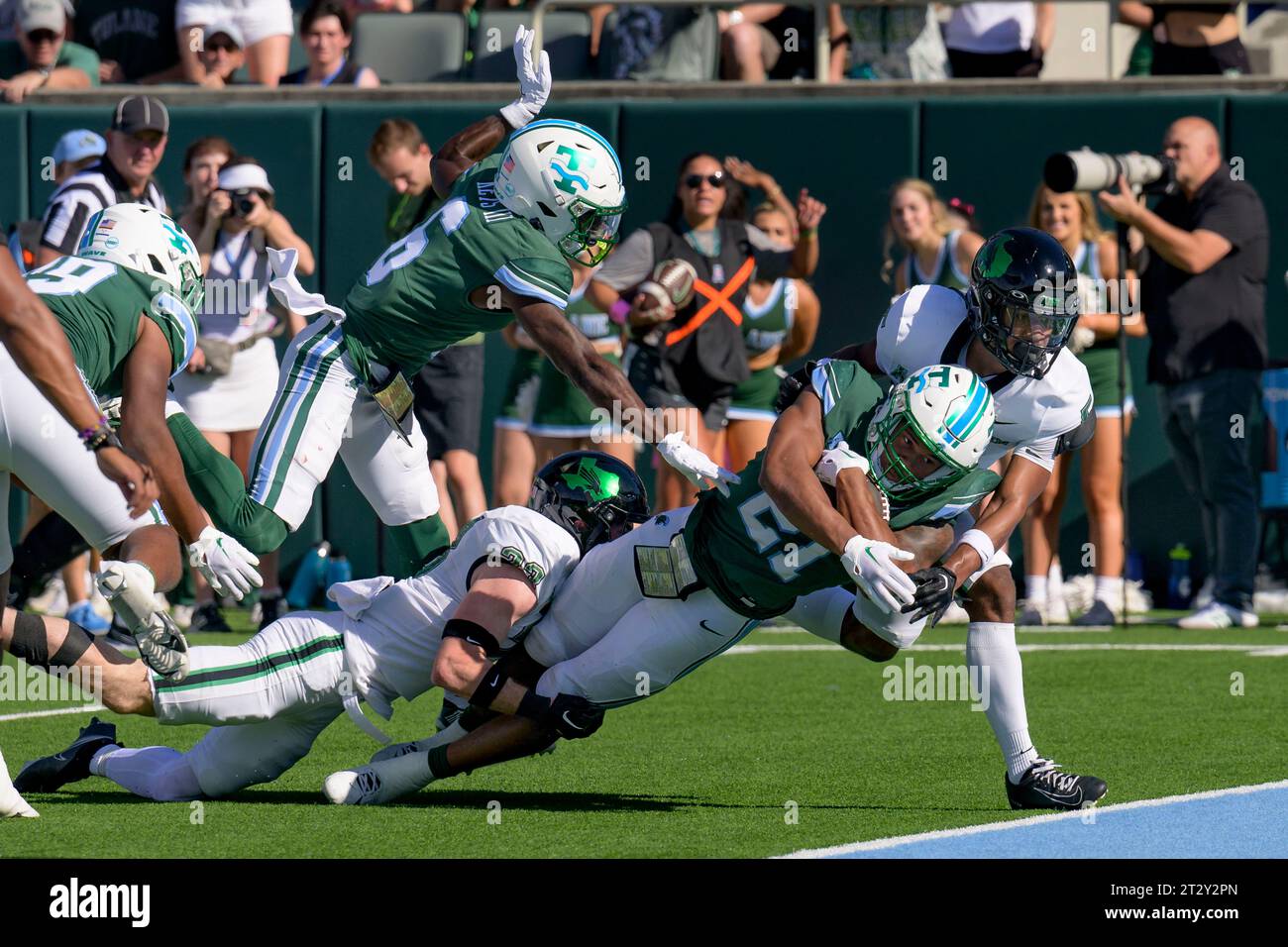 Tulane running back Makhi Hughes (21) scores a touchdown against North ...