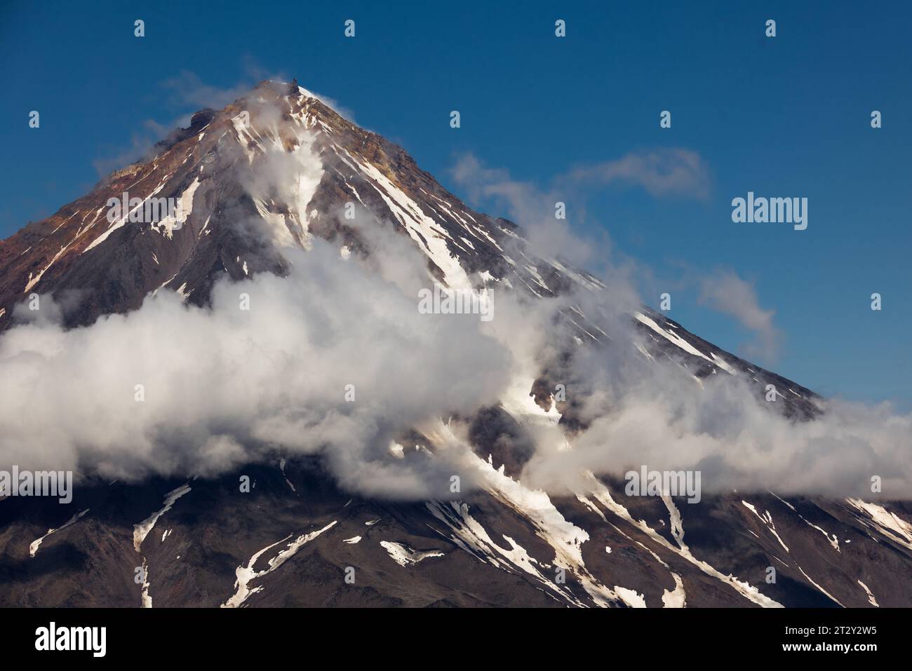 view of the peaks of the Koryak volcano on the Kamchatka peninsula ...