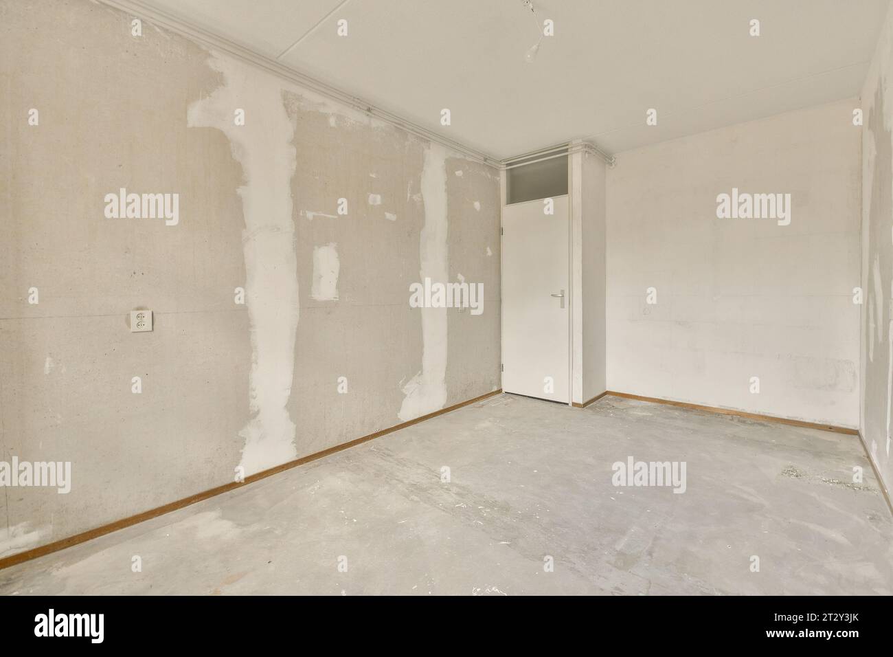 an unfinished room with white walls and dry plaster on the wall is ...