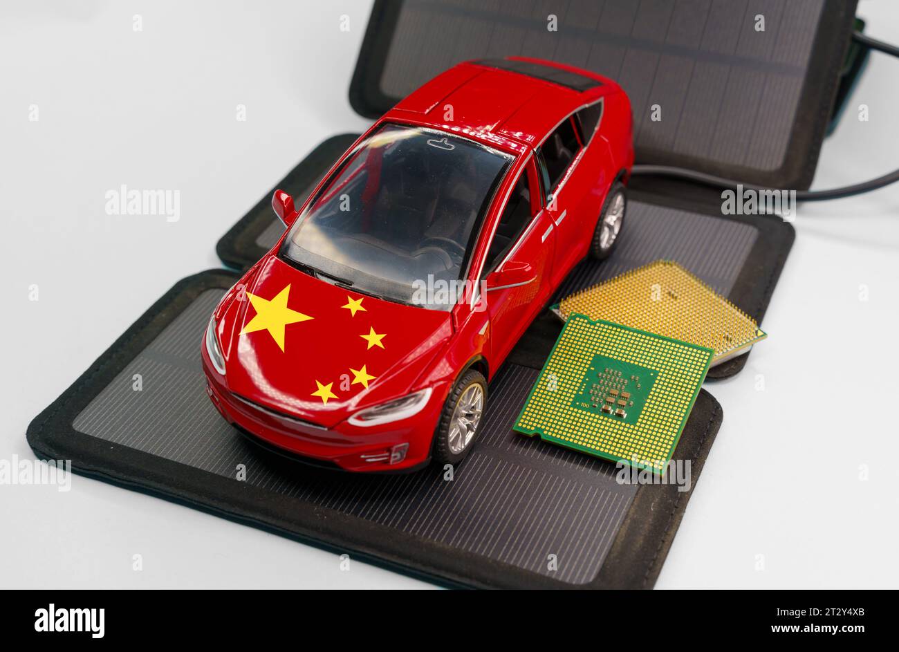 Toy car painted with the flag of china over a little solar panel and ...