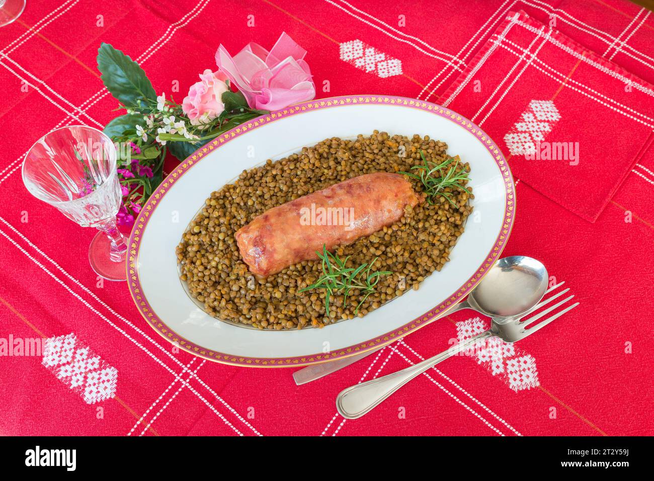 Cotechino (pork sausage) with lentils. Traditional Italian dish Stock ...