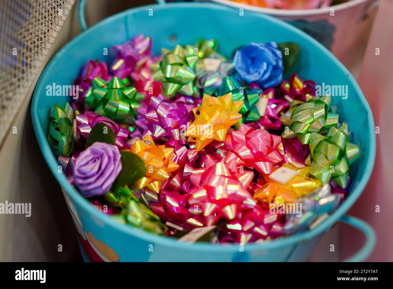 Festive ribbon decor: assortment of star-shaped gift ribbons stacked in ...