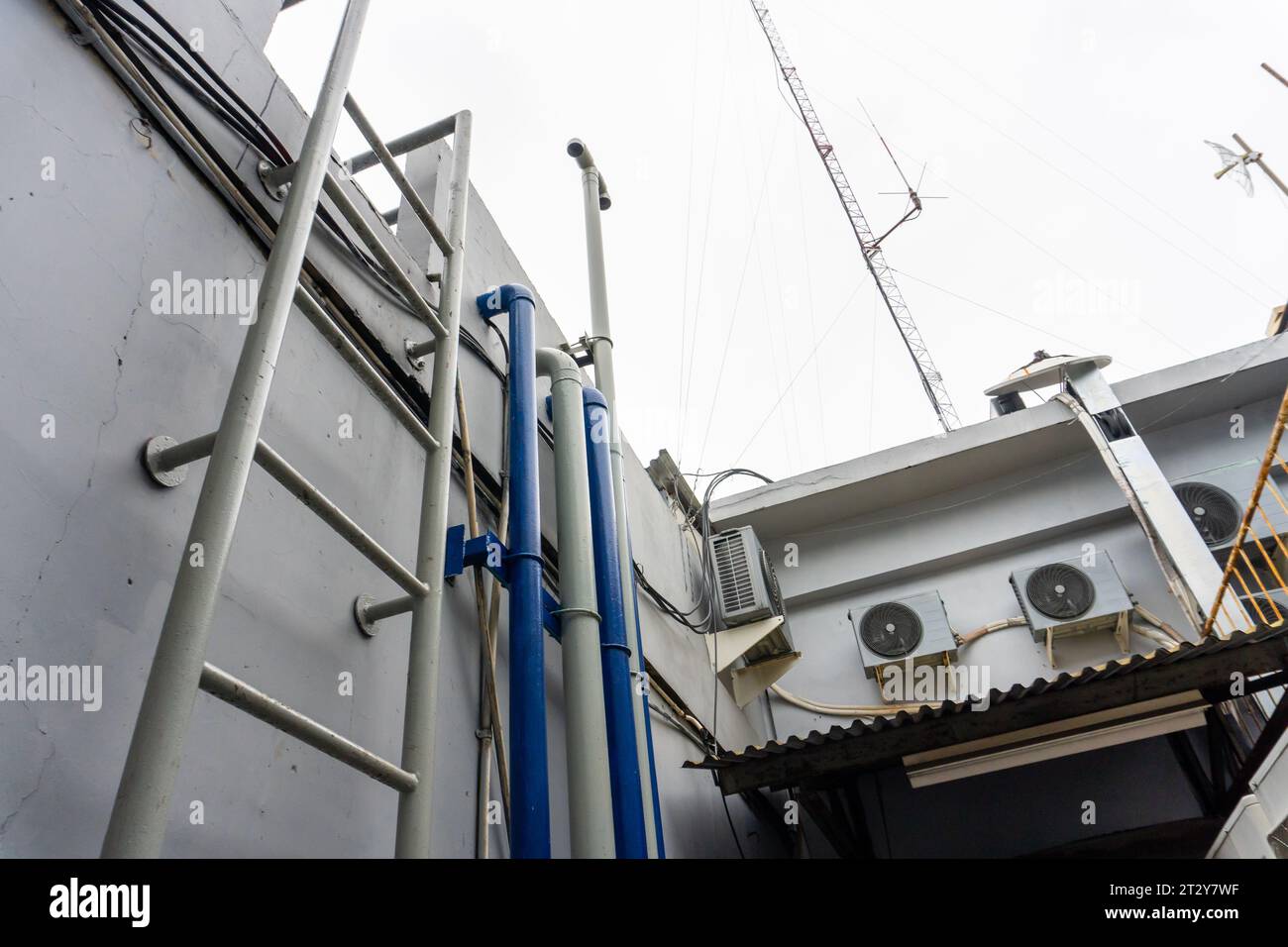Stairway to the rooftop of a high-rise building featuring iron pipe ...
