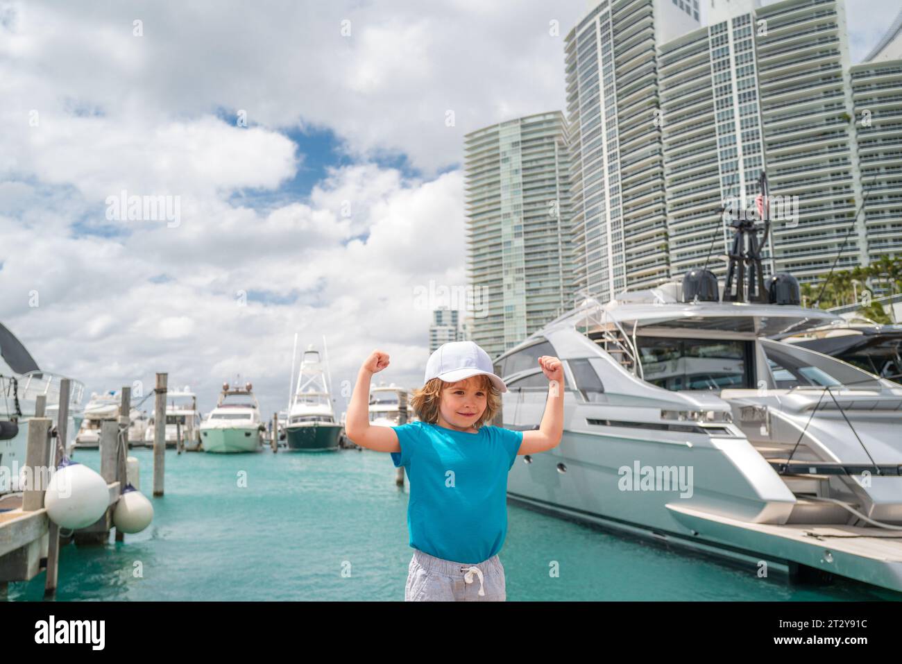 Kid play on Miami marine. Portrait of kid outdoors. Close-up face child ...