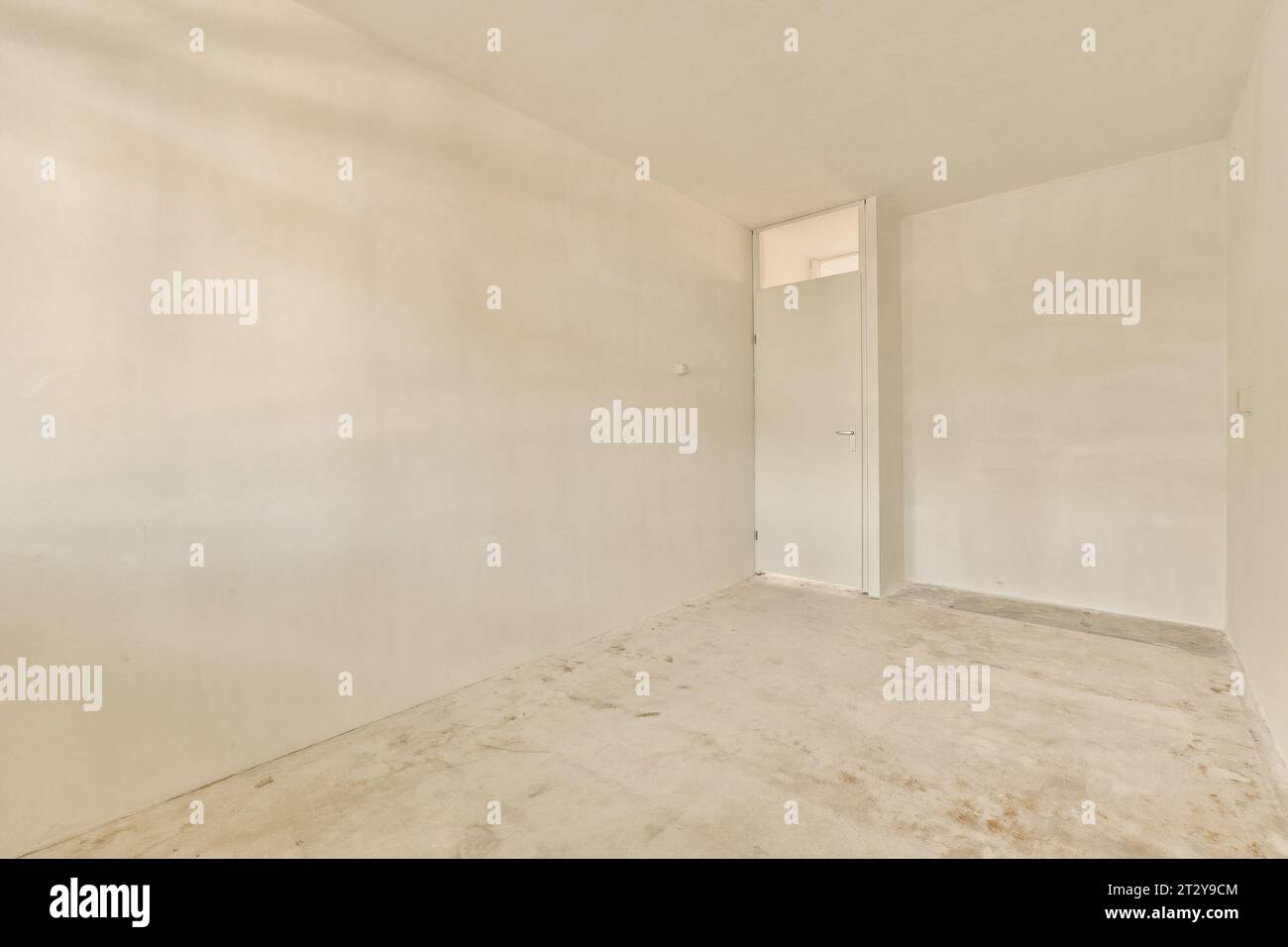 an empty room with white walls and no one wall in the room is visible ...