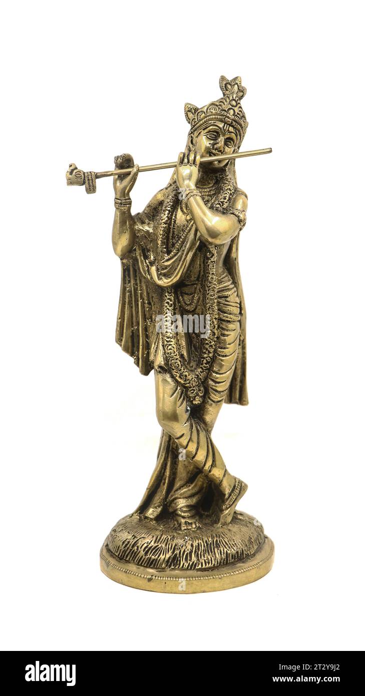 golden brass statue of hindu god lord krishna in a rural attire playing ...