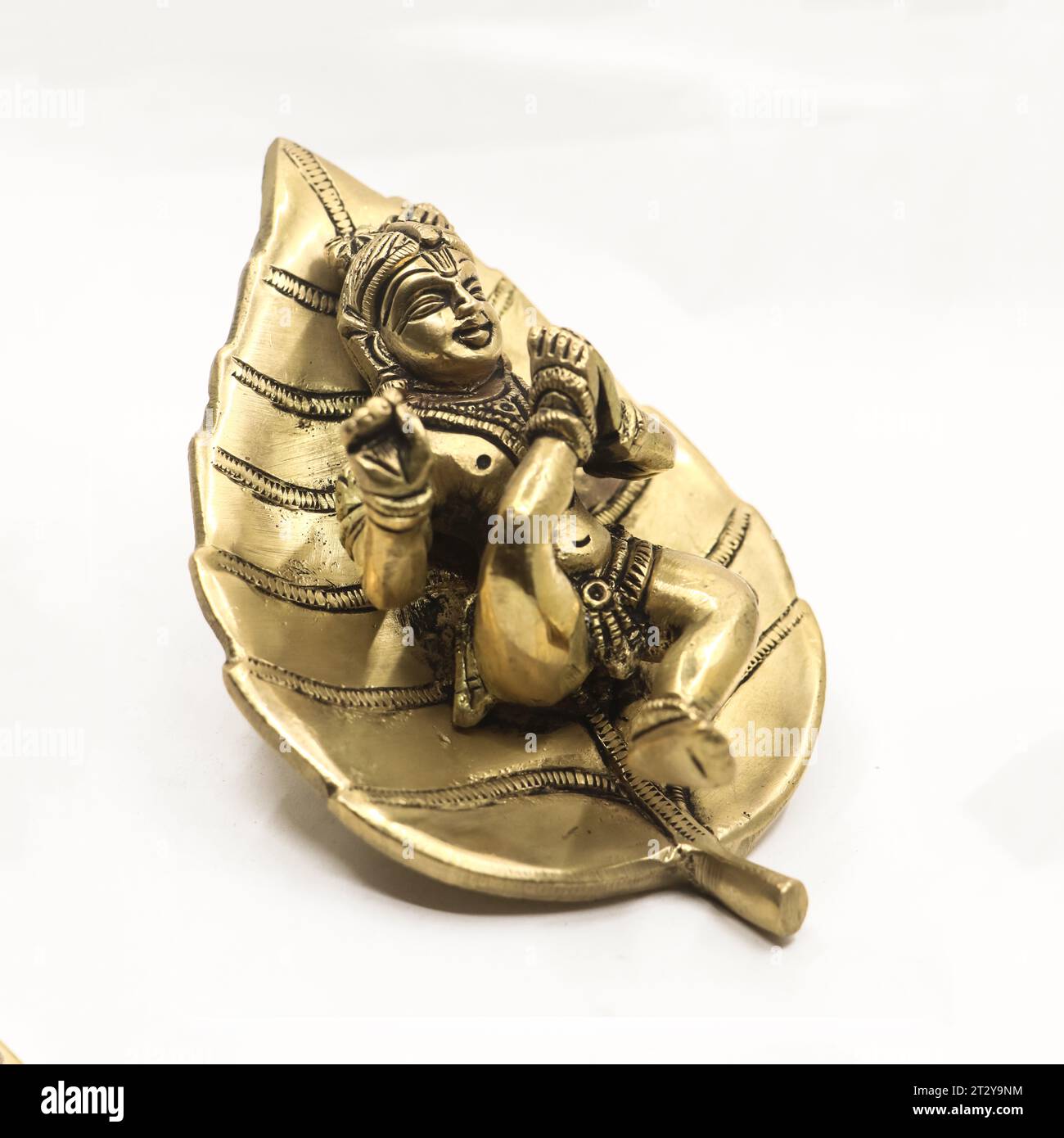 hindu god lord baby krishna on a leaf statue crafted in detail on shiny ...