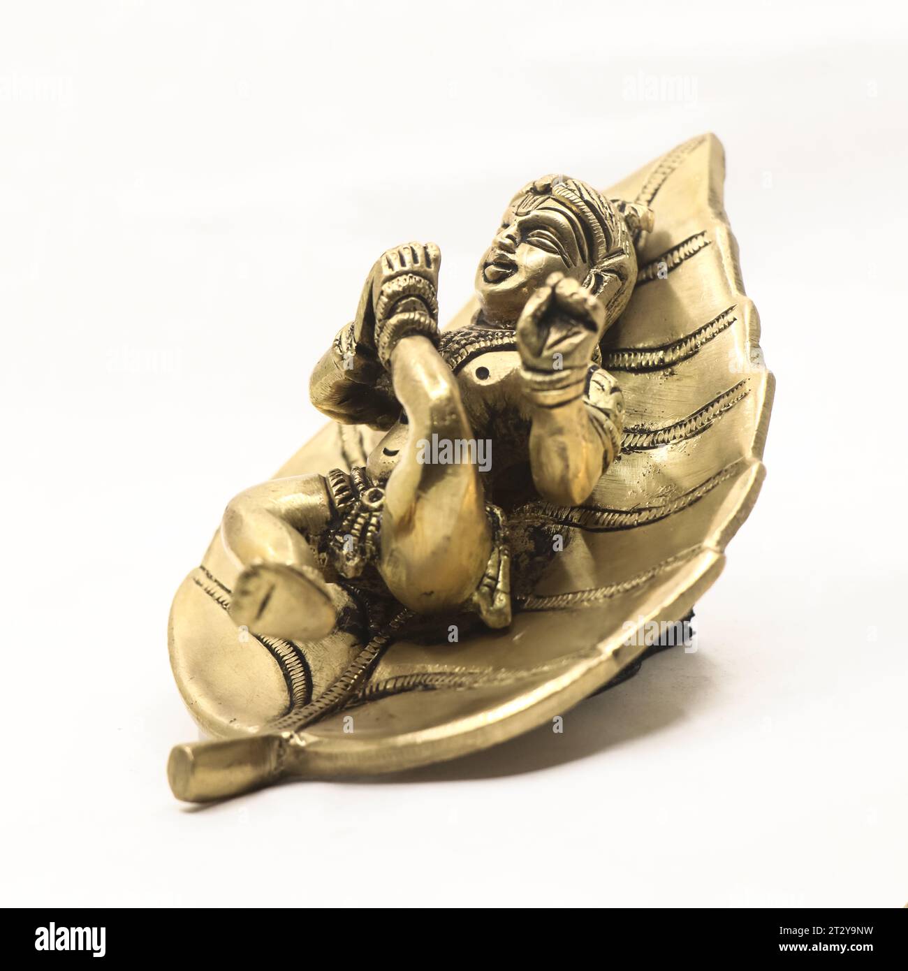 hindu god lord baby krishna on a leaf statue crafted in detail on shiny ...